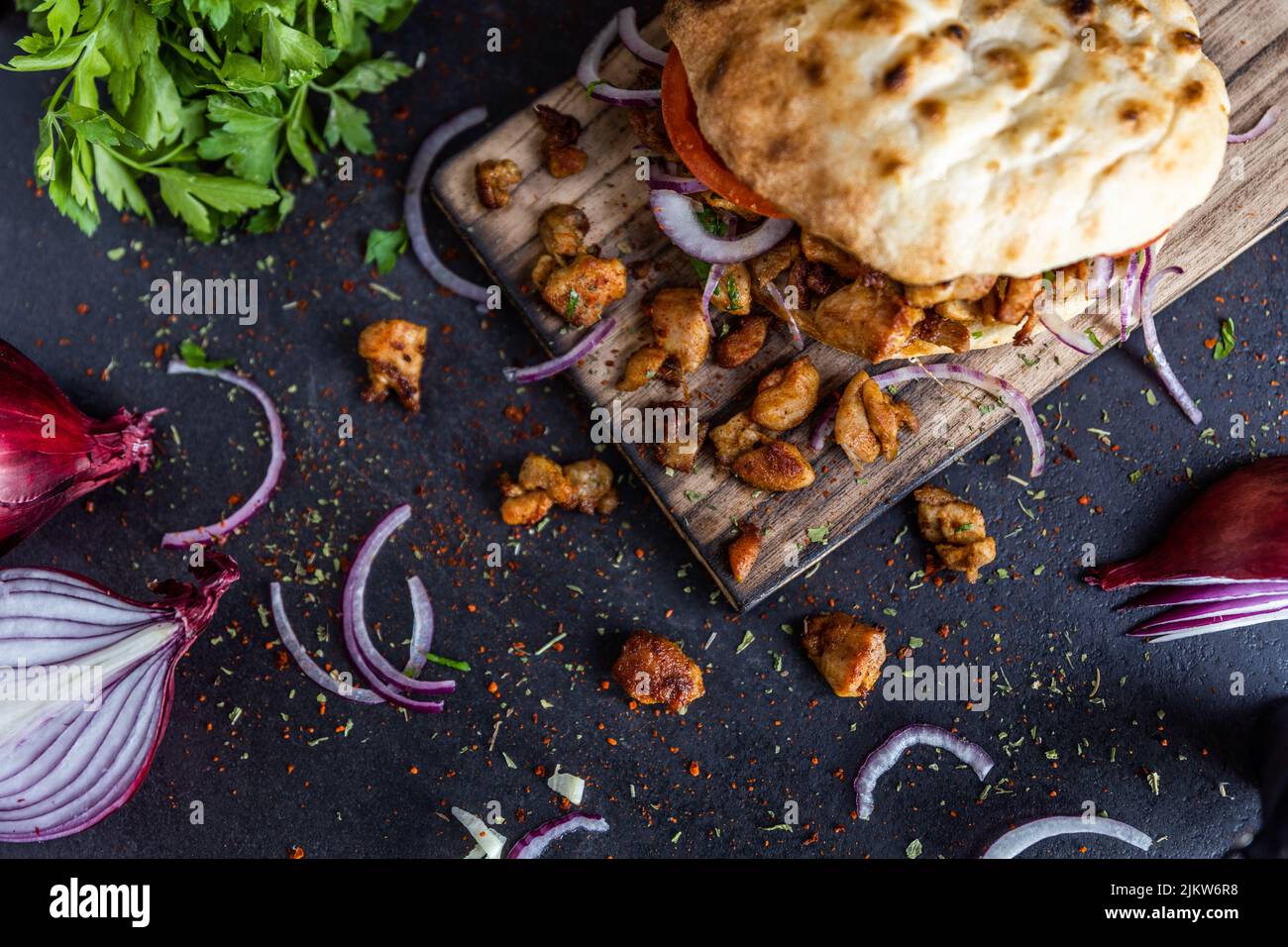A top view of a delicious homemade doner in bread with meat, onions and ...