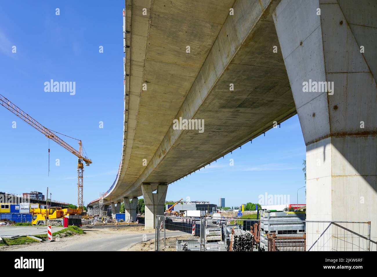 New modern road overpass concrete bridge construction site with yellow ...