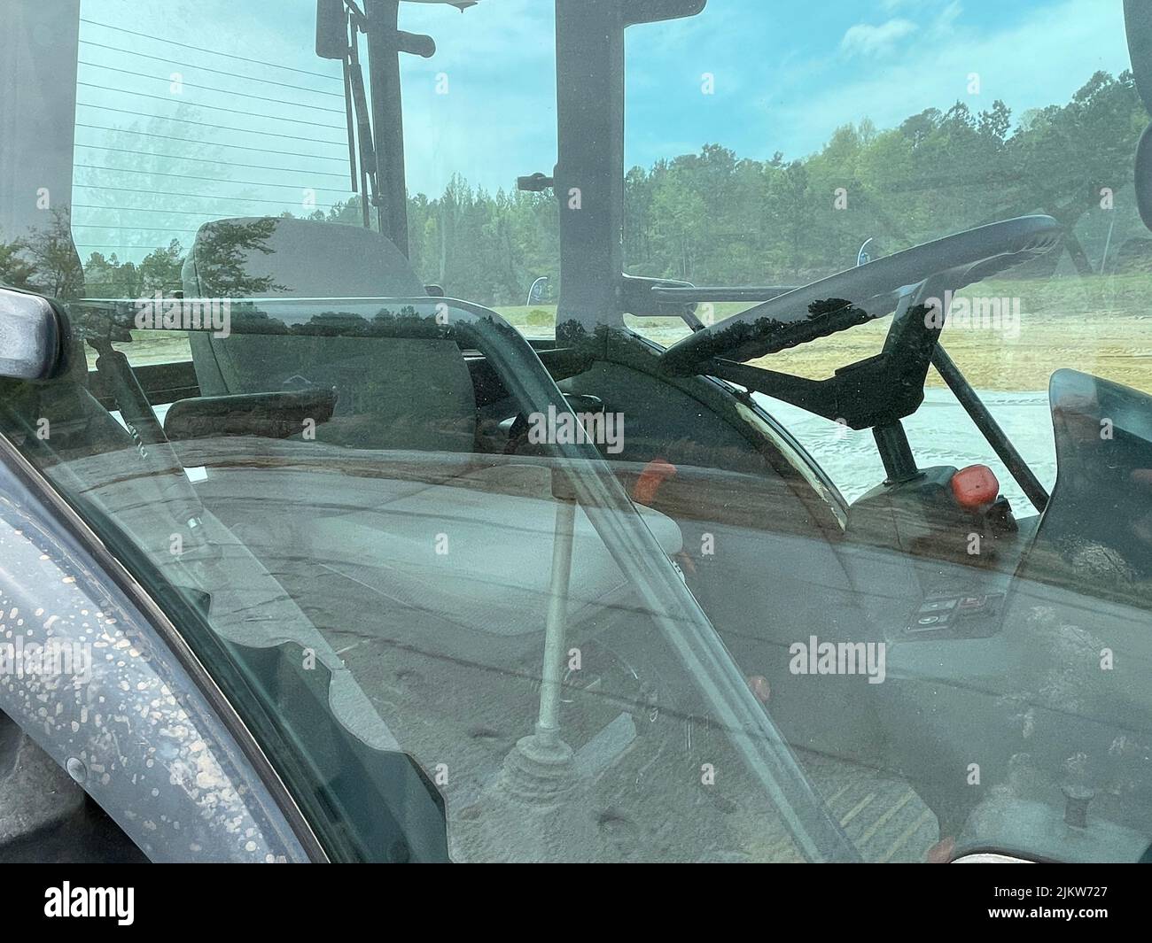 Augusta, Ga USA - 04 13 22: Kubota red tractor glass of cab Stock Photo ...