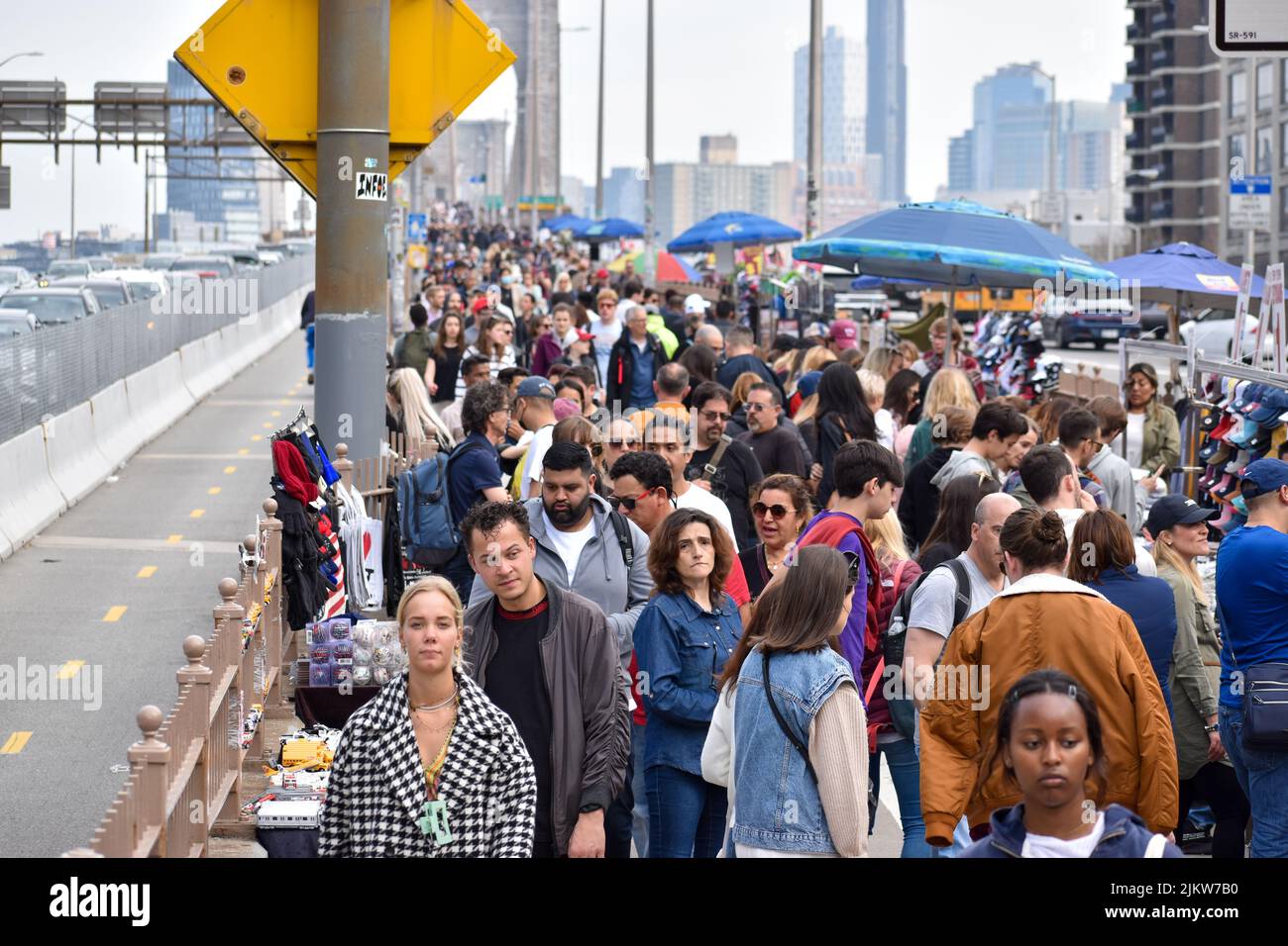 Tourists are coming back to New York City. A big crowd is seen walking ...