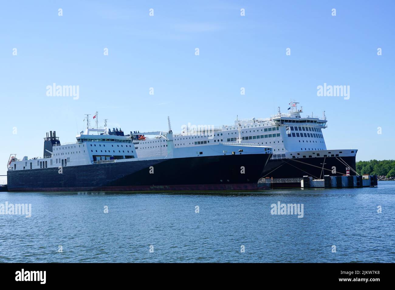 Two large Ro-Ro cargo and passenger ferries moored in the seaport Stock ...