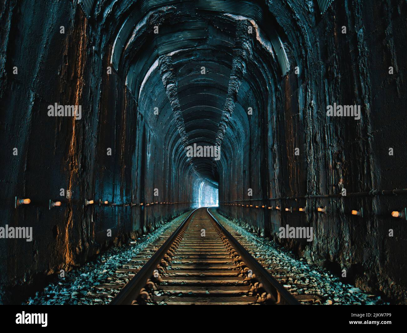 An old and rustic railroad inside a tunnel Stock Photo - Alamy
