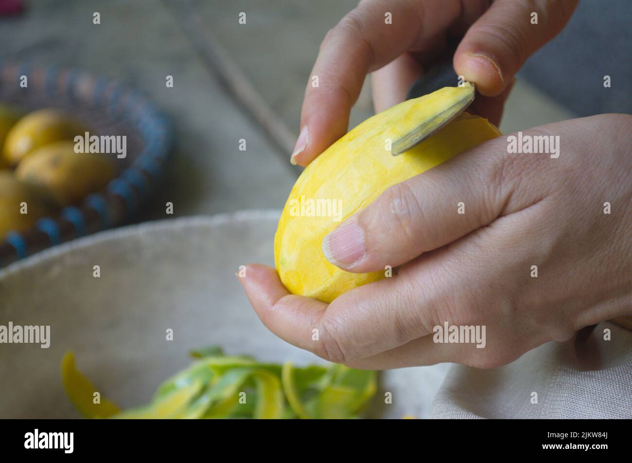 Woman mango peeling hi-res stock photography and images - Alamy