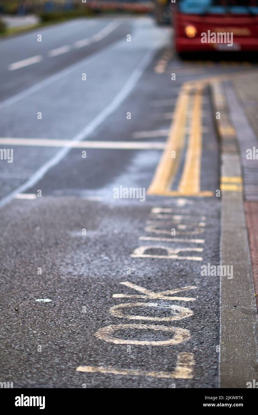 a vertical shot of red double decker buss on bus stop Stock Photo - Alamy