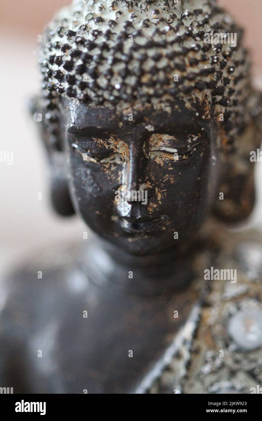 An aged bronze statue of Buddha Stock Photo - Alamy