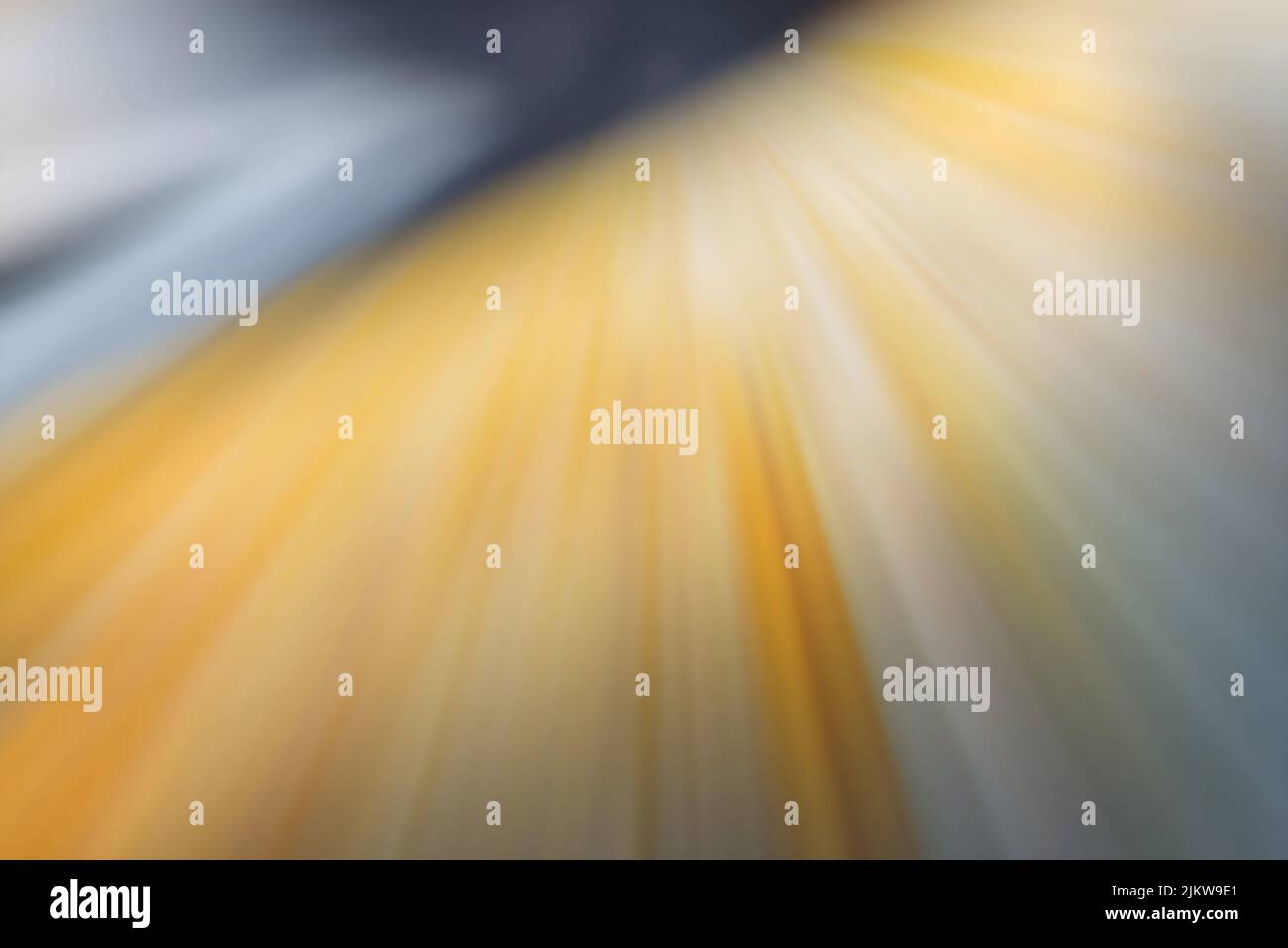 Blurry yellow light rays in fast motion Stock Photo - Alamy