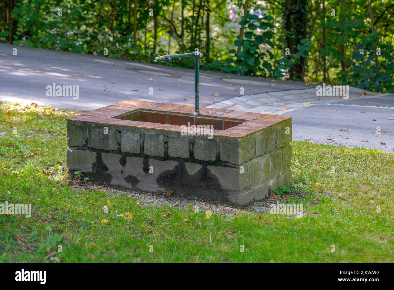 A closeup of brick construction with a water tube Stock Photo - Alamy