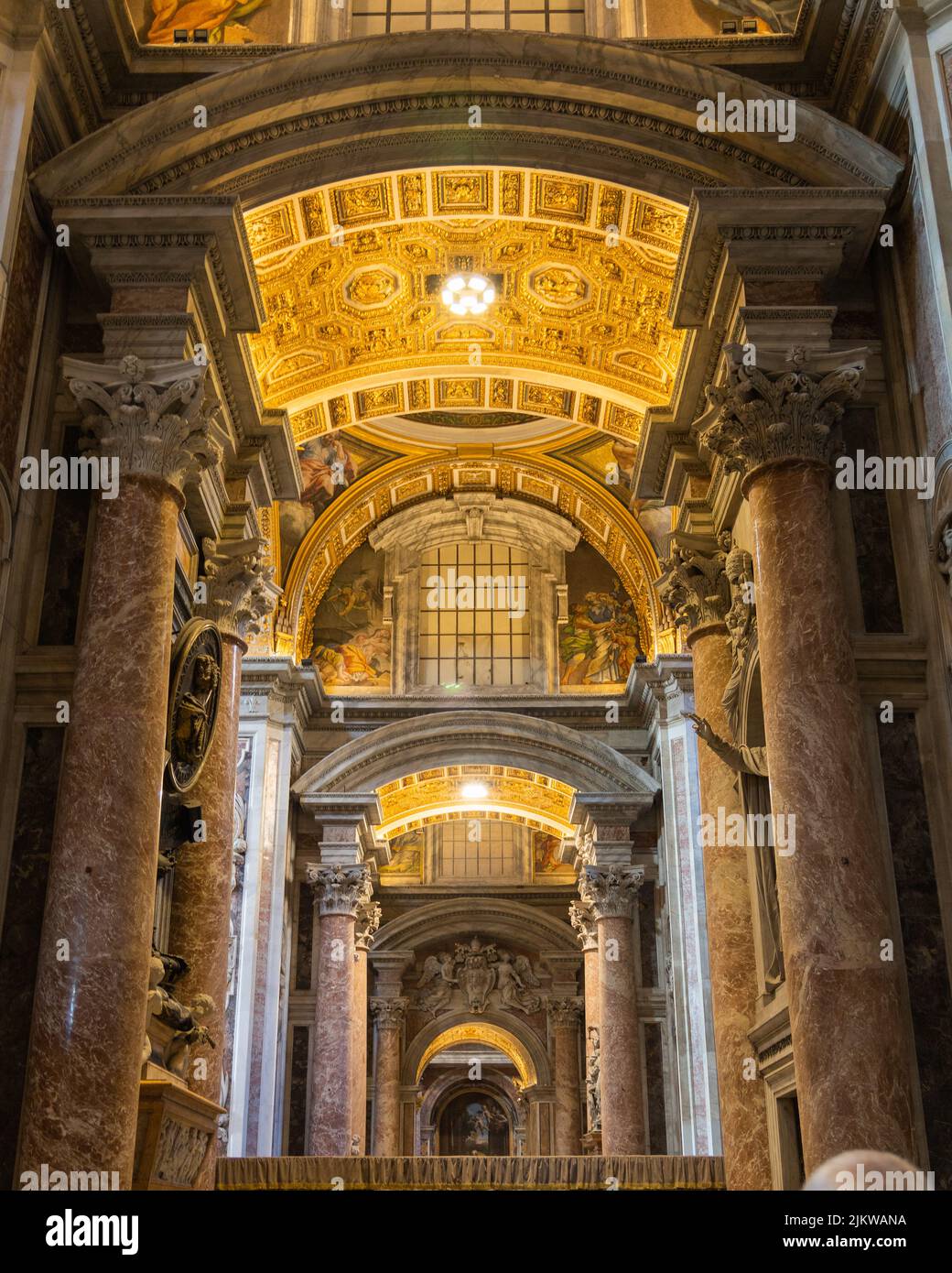 A vertical shot of the beautiful interior of The Papal Basilica of ...