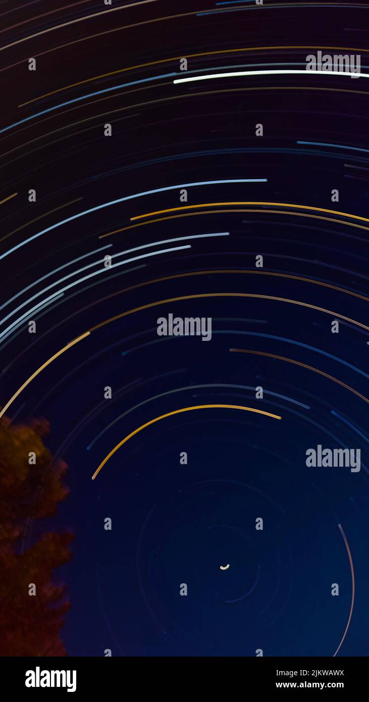 A vertical shot of starry night sky looking towards the north star just ...