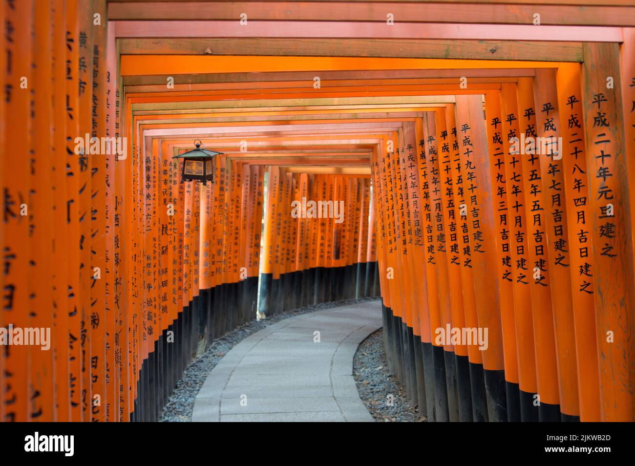 A torii gate path in Kyoto Japan marking the transition to sacred land ...