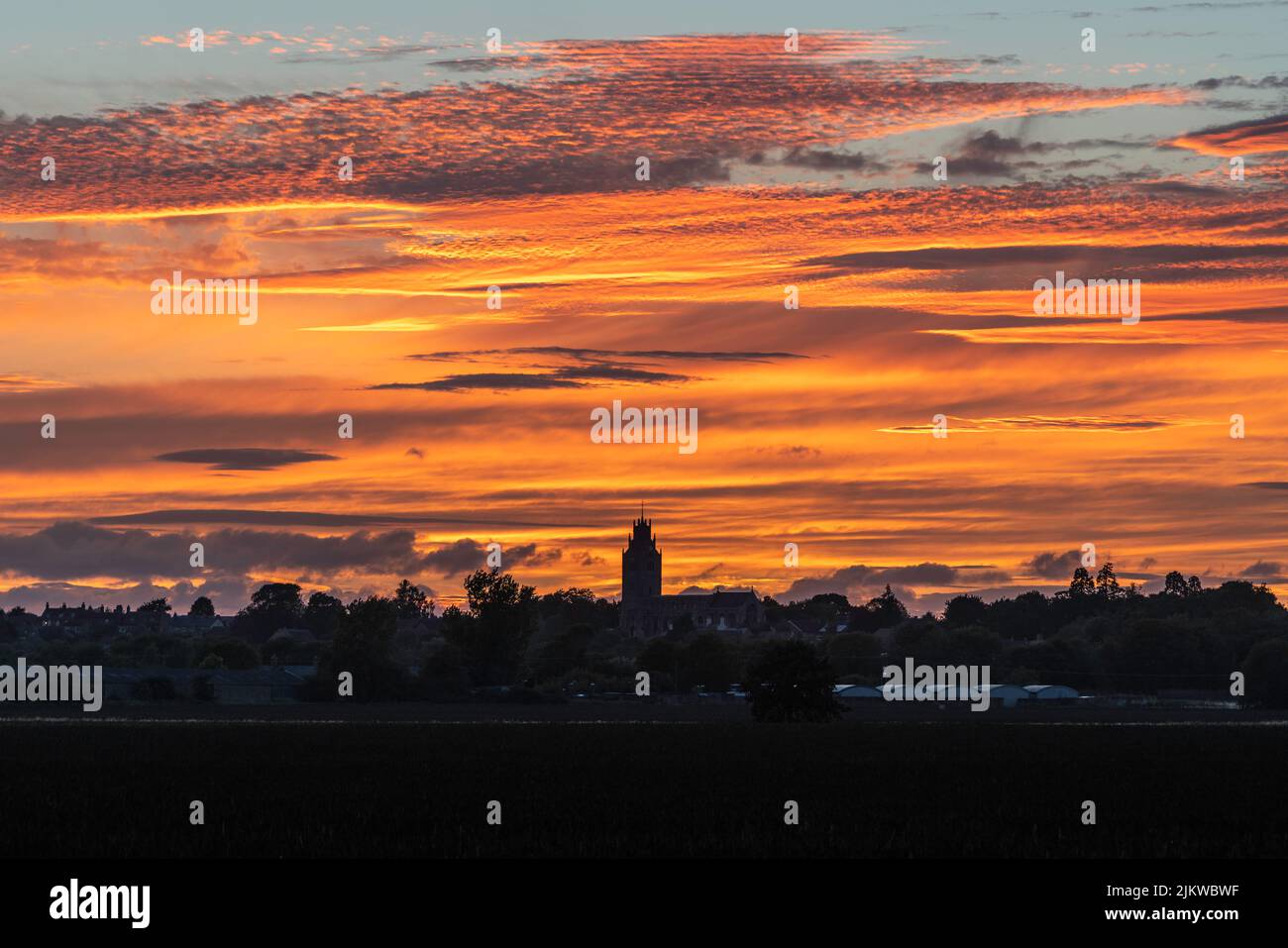 Sunset behind the village of Sutton-in-the-Isle, Cambridgeshire Stock ...