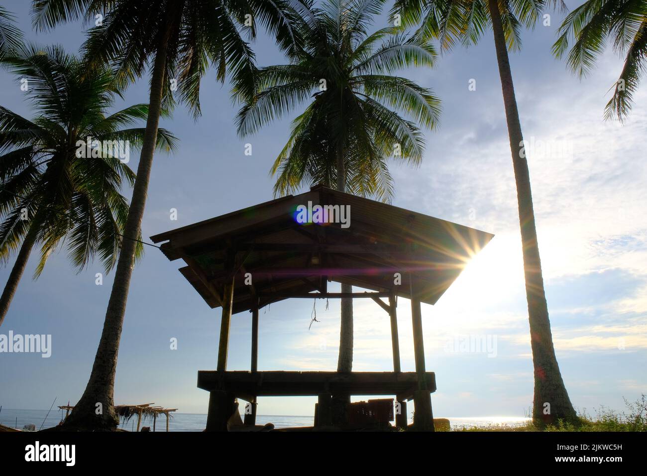 Tropical gazebo on an Irama beach with coconut palm trees at Kelantan ...
