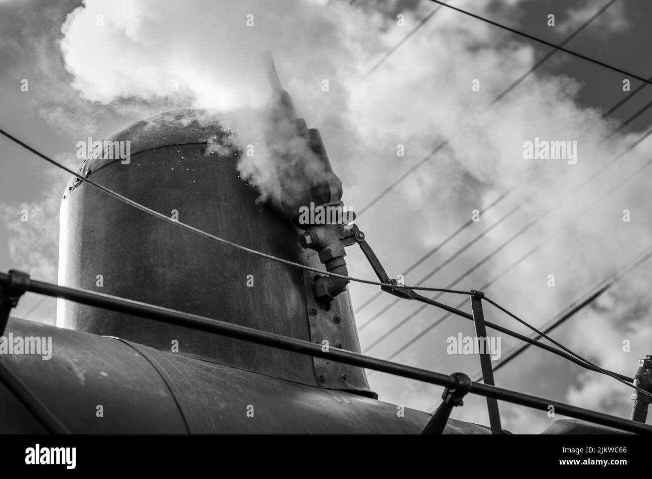 A closeup grayscale shot of a train steam engine with a whistle Stock ...