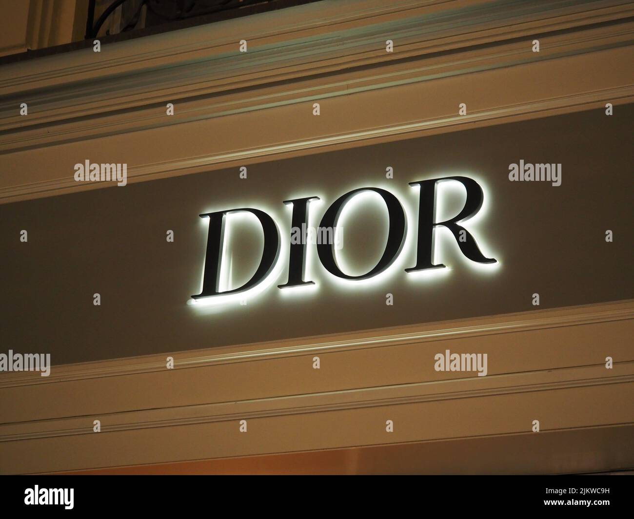 Dior sign lighting in the night, sign in front of the luxury fashion ...