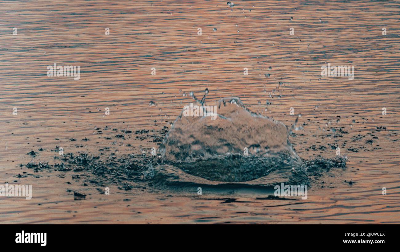 The splashing water in the sea Stock Photo - Alamy