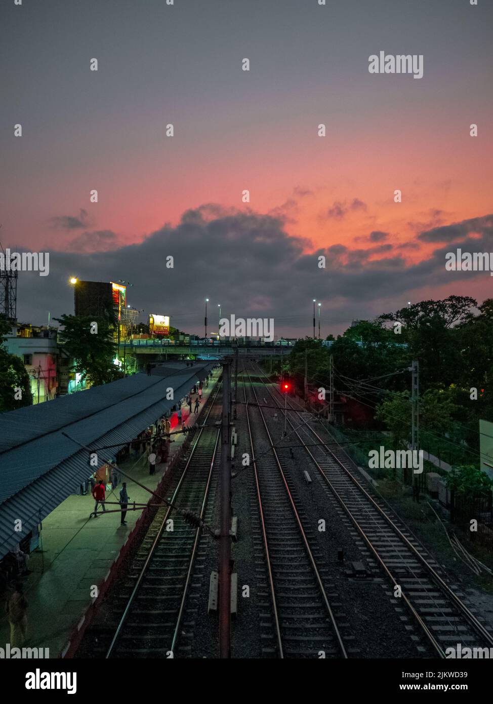 A beautiful shot of the train station and people waiting for the train ...