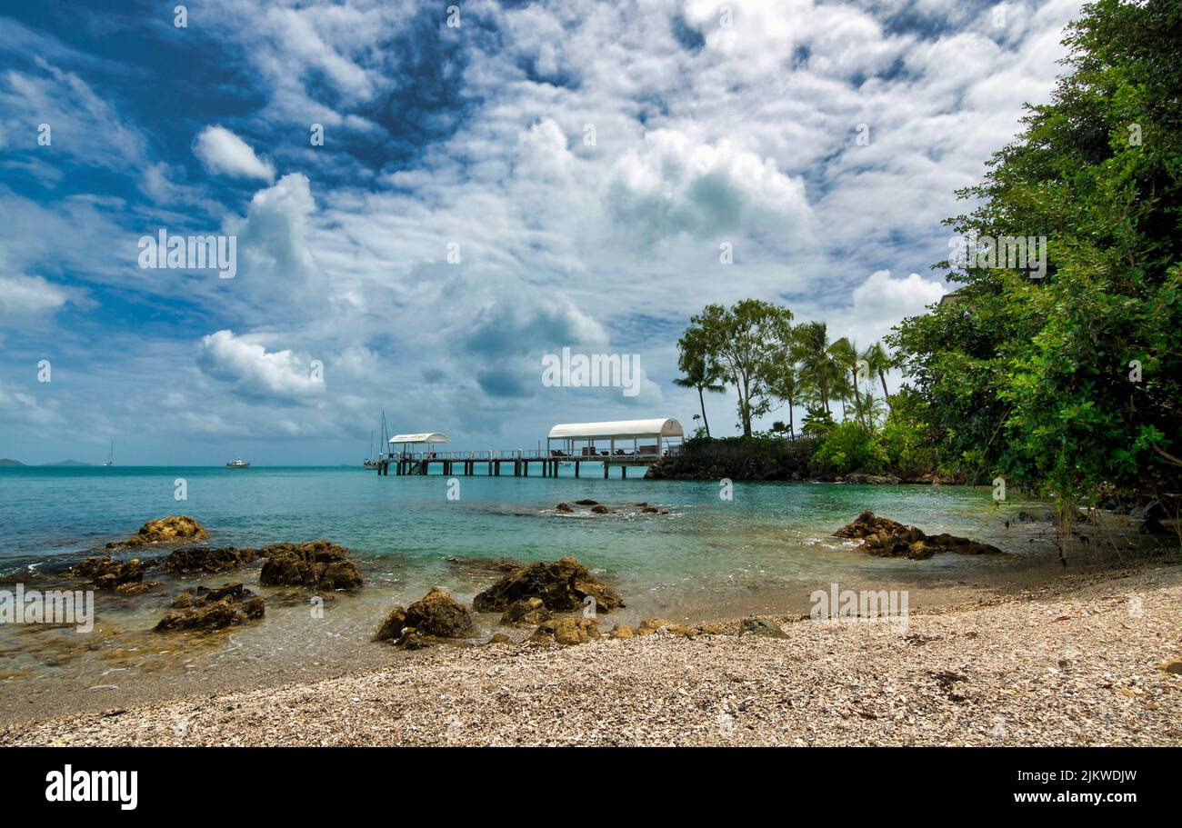 A beautiful sunny sky over the Airlie Beach in Whitsunday Coast in ...