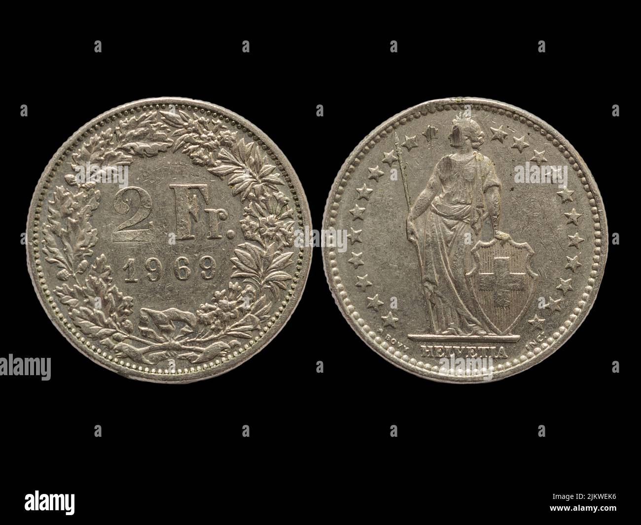 A vintage Swiss franks coin isolated on a black background Stock Photo ...