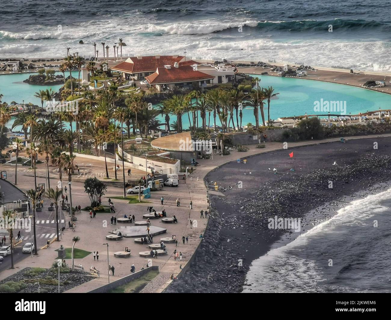 An aerial shot of a Lago Martianez Outdoor swimming pool next to a wavy ...