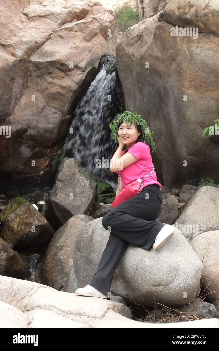 A girl in front of a waterfall in Duijiu Valley,Beijing,China Stock ...