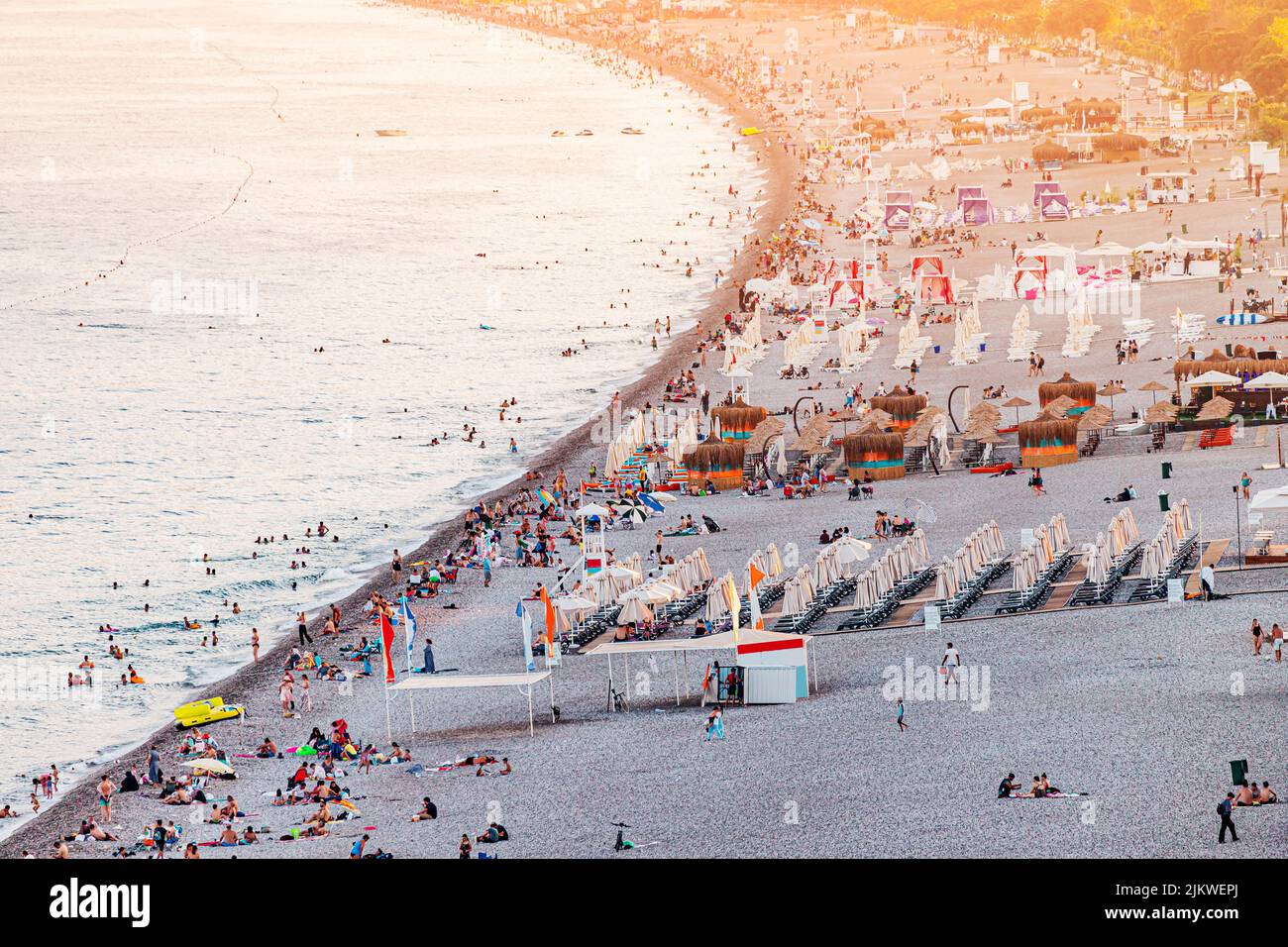 Crowded Antalya city Konyaalti beach with hundreds of vacationers and ...
