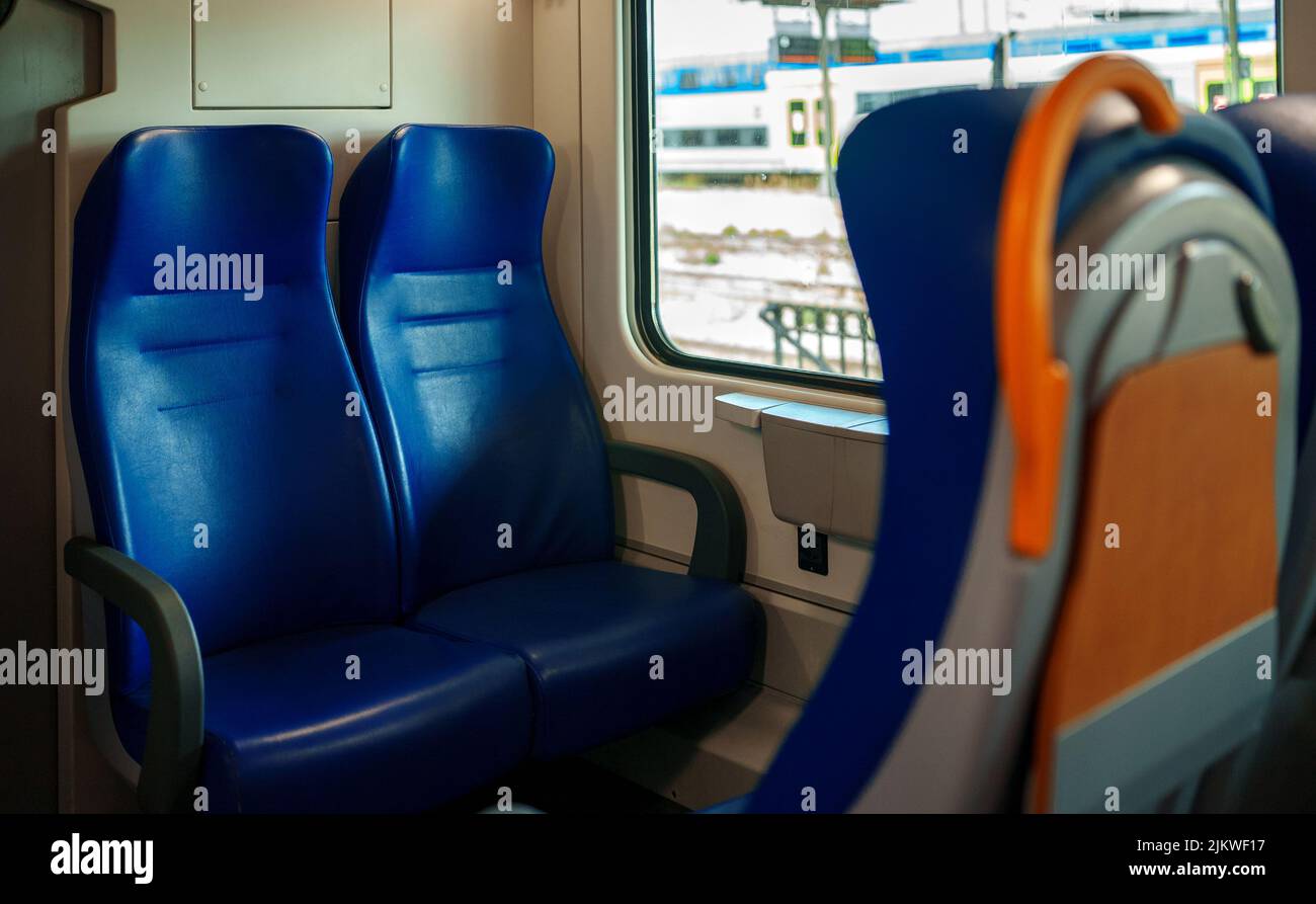 Blue seats in a modern electric train Stock Photo - Alamy