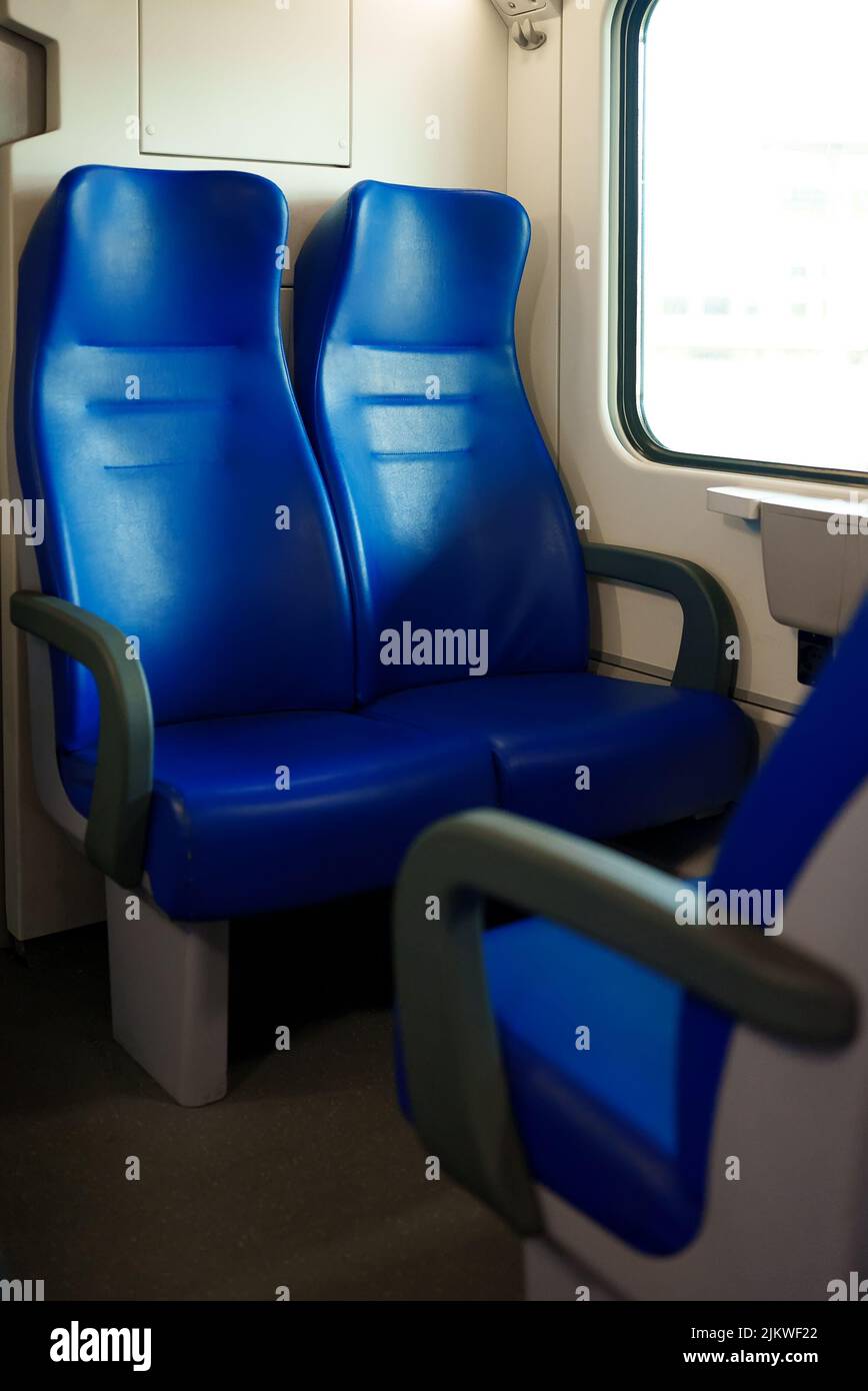 Blue seats in a modern electric train Stock Photo - Alamy