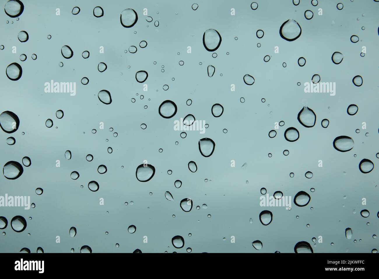 Vibrant waterdrops on a glass window Stock Photo - Alamy