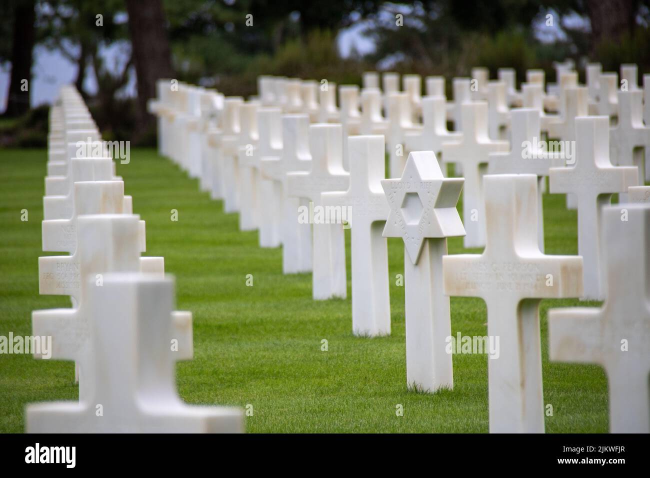 The Normandy American Cemetery and Memorial under the cloudy skies ...