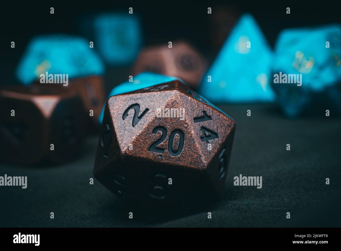A closeup of a brown dungeons and dragons dice in icosahedron shape on ...