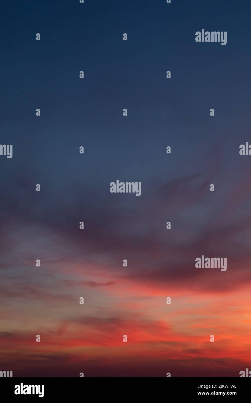 A vertical shot of a beautiful blue and pink sunset that can be used as ...