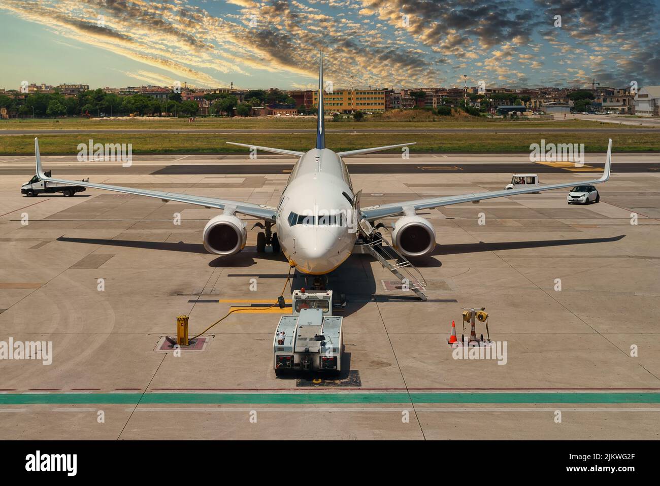TUG Pushback tractor with Aircraft on the runway in airport Stock Photo ...