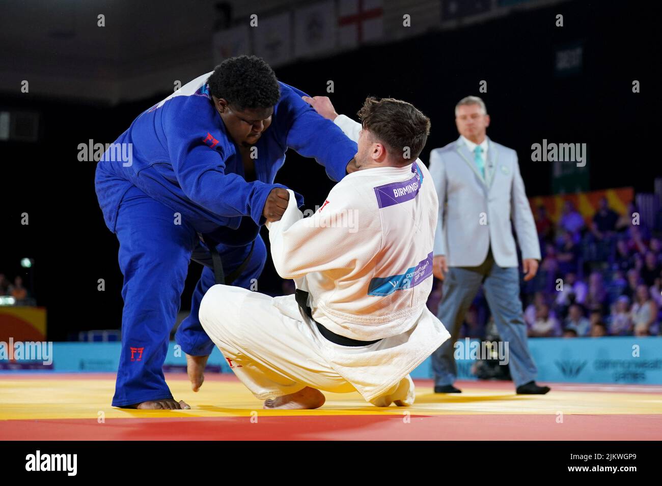 Mauritius’ Sebastien Perrinne (blue) and Scotland’s Andrew McWatt in ...