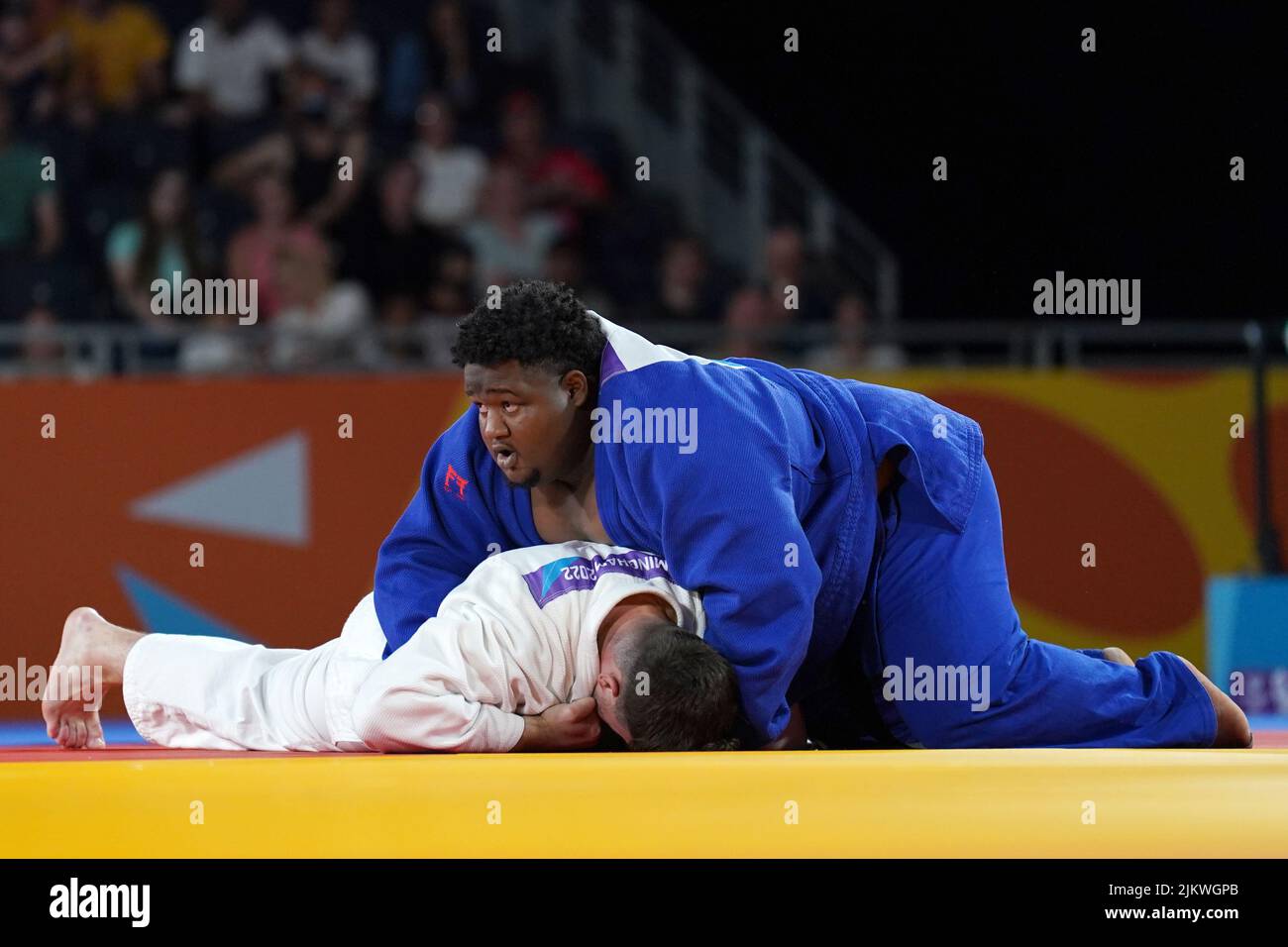 Mauritius’ Sebastien Perrinne (blue) and Scotland’s Andrew McWatt in ...