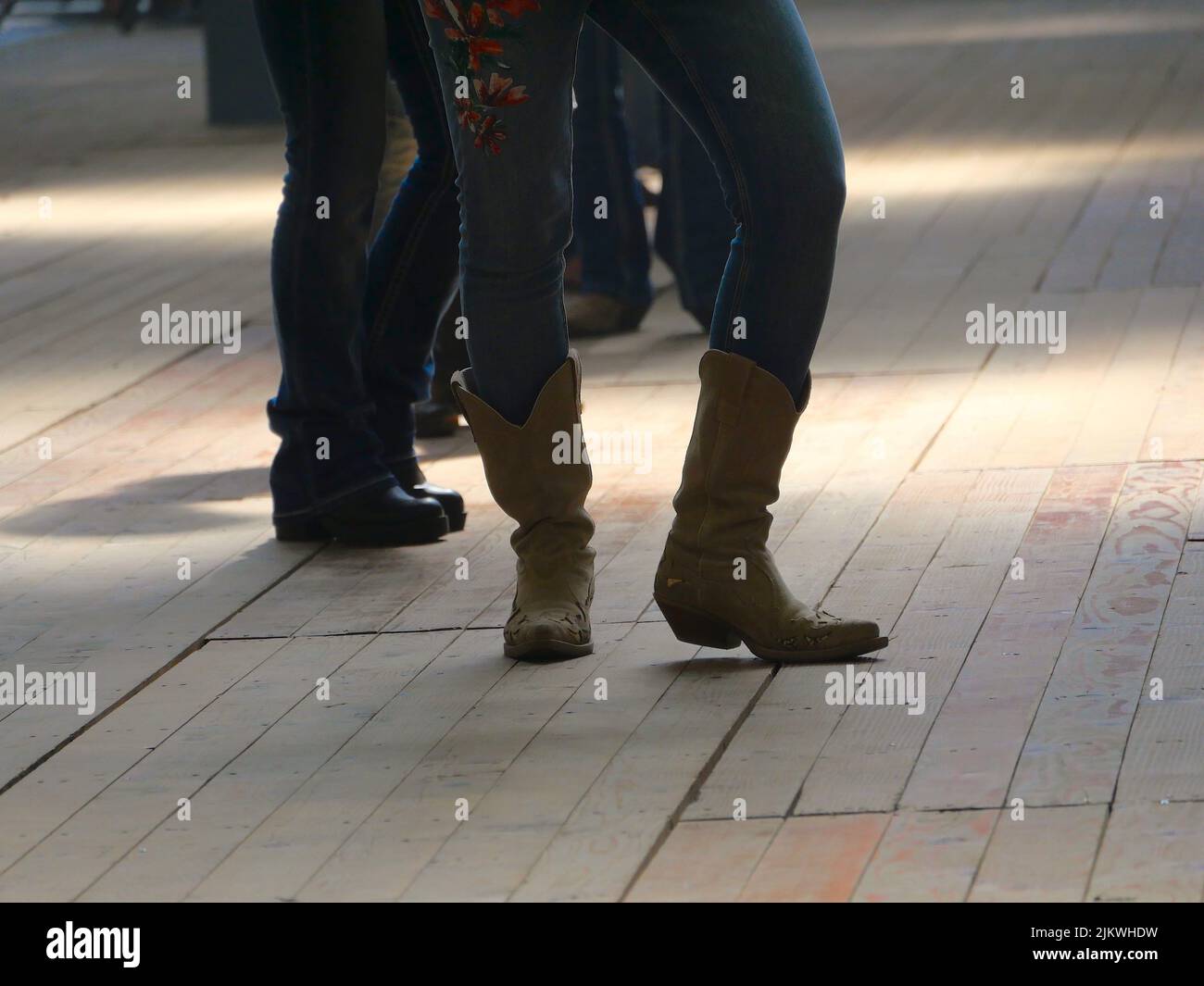 A closeup of the traditional western folk music dancers in cowboy boots ...