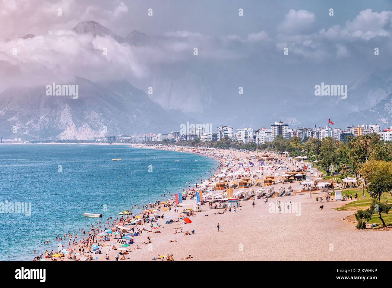 Crowded Antalya city Konyaalti beach with hundreds of vacationers and ...