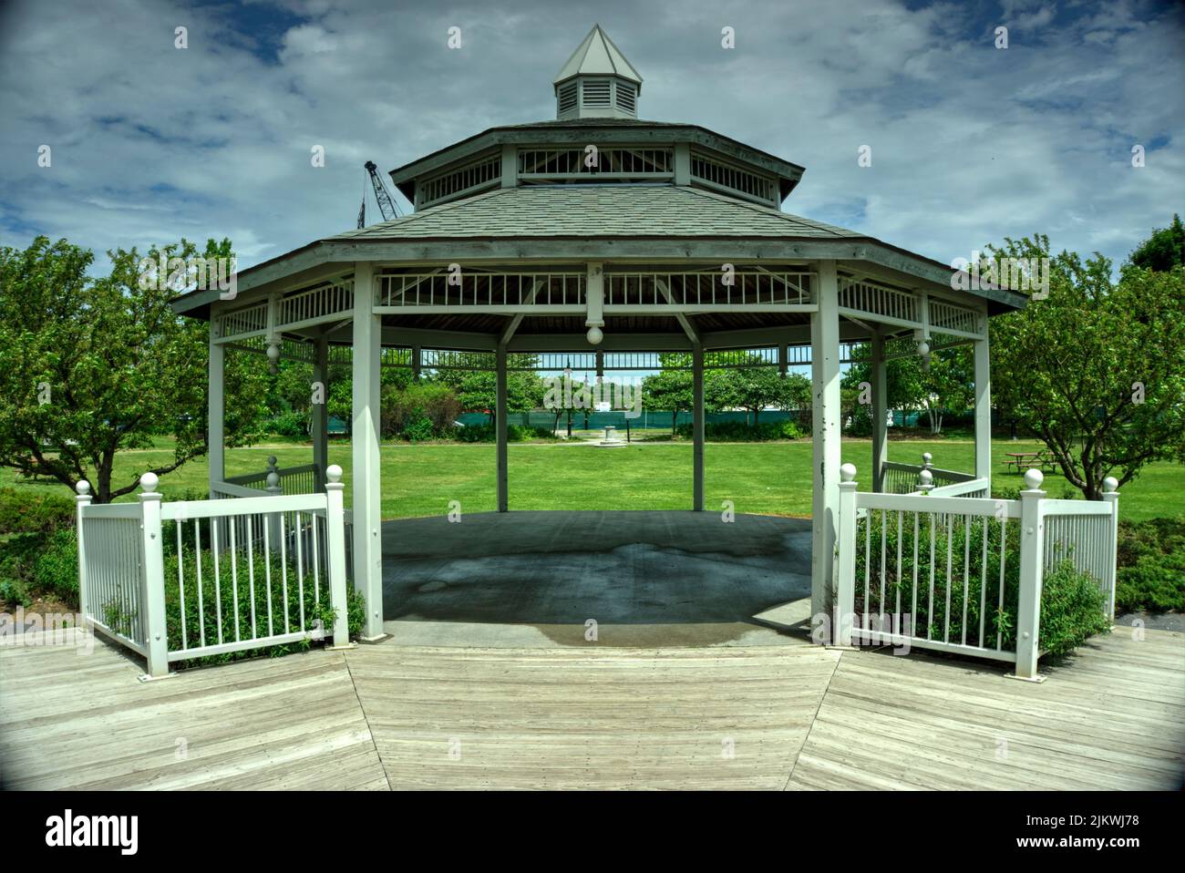 A closeup of a beautiful pavilion recreation area with white fences and ...
