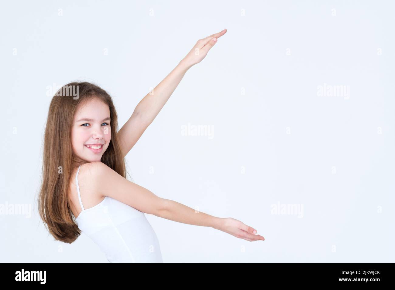 little kid girl holding hands showing big size Stock Photo - Alamy