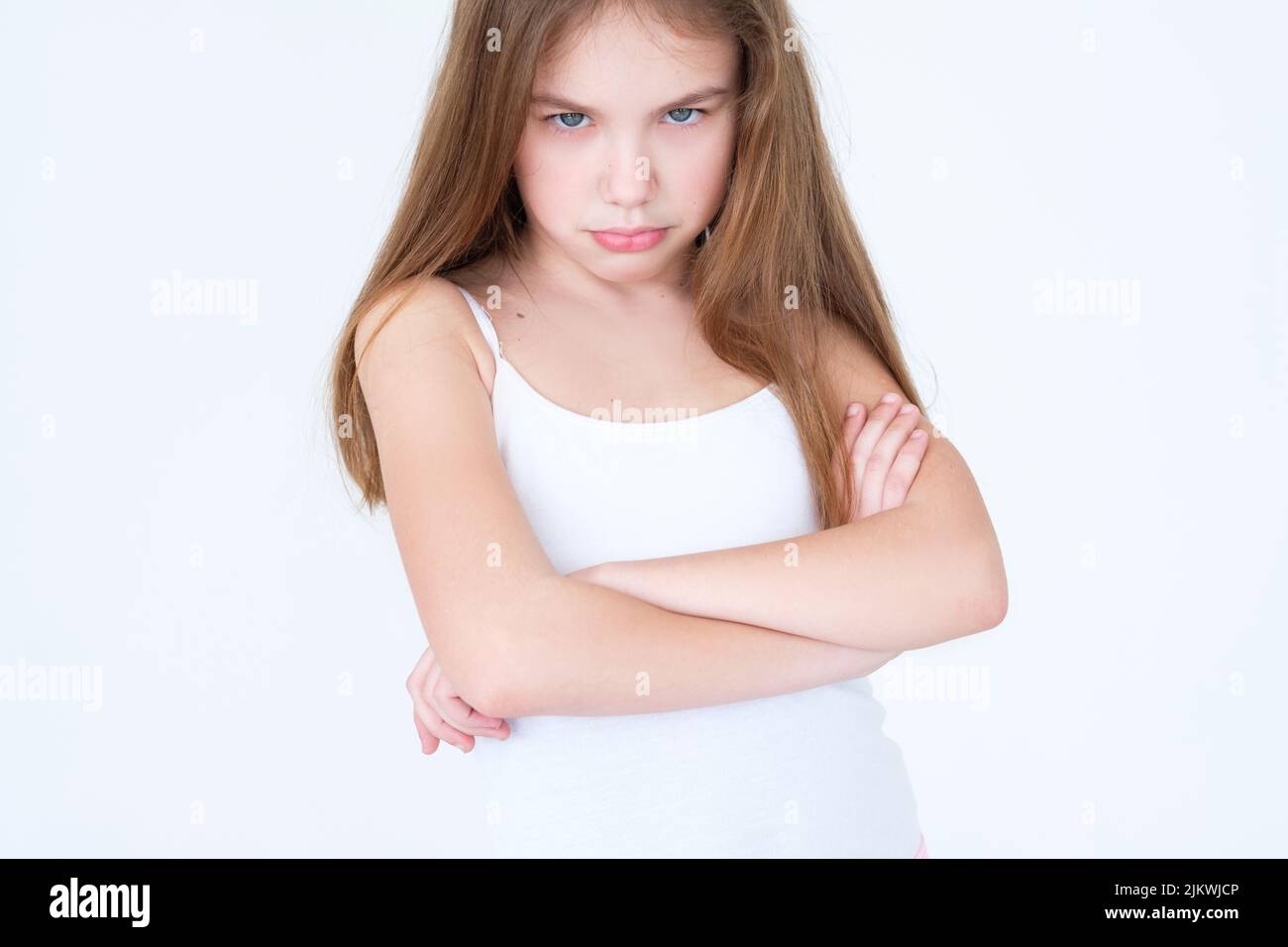 emotion hurt look offended kid girl crossed arms Stock Photo - Alamy