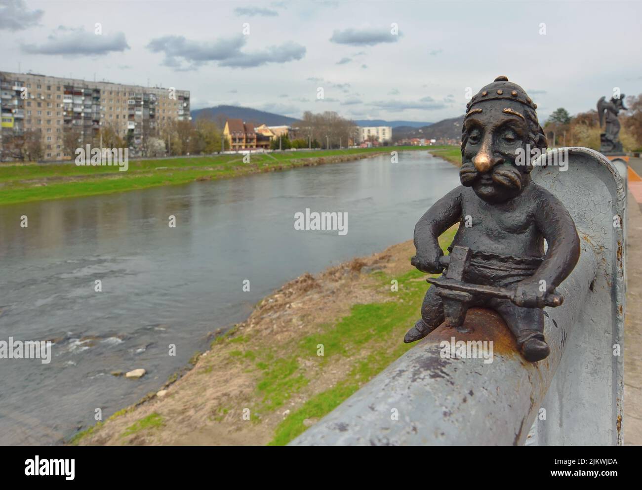 Blacksmith statue on the bridge over Latorica river in Mukacheve town ...