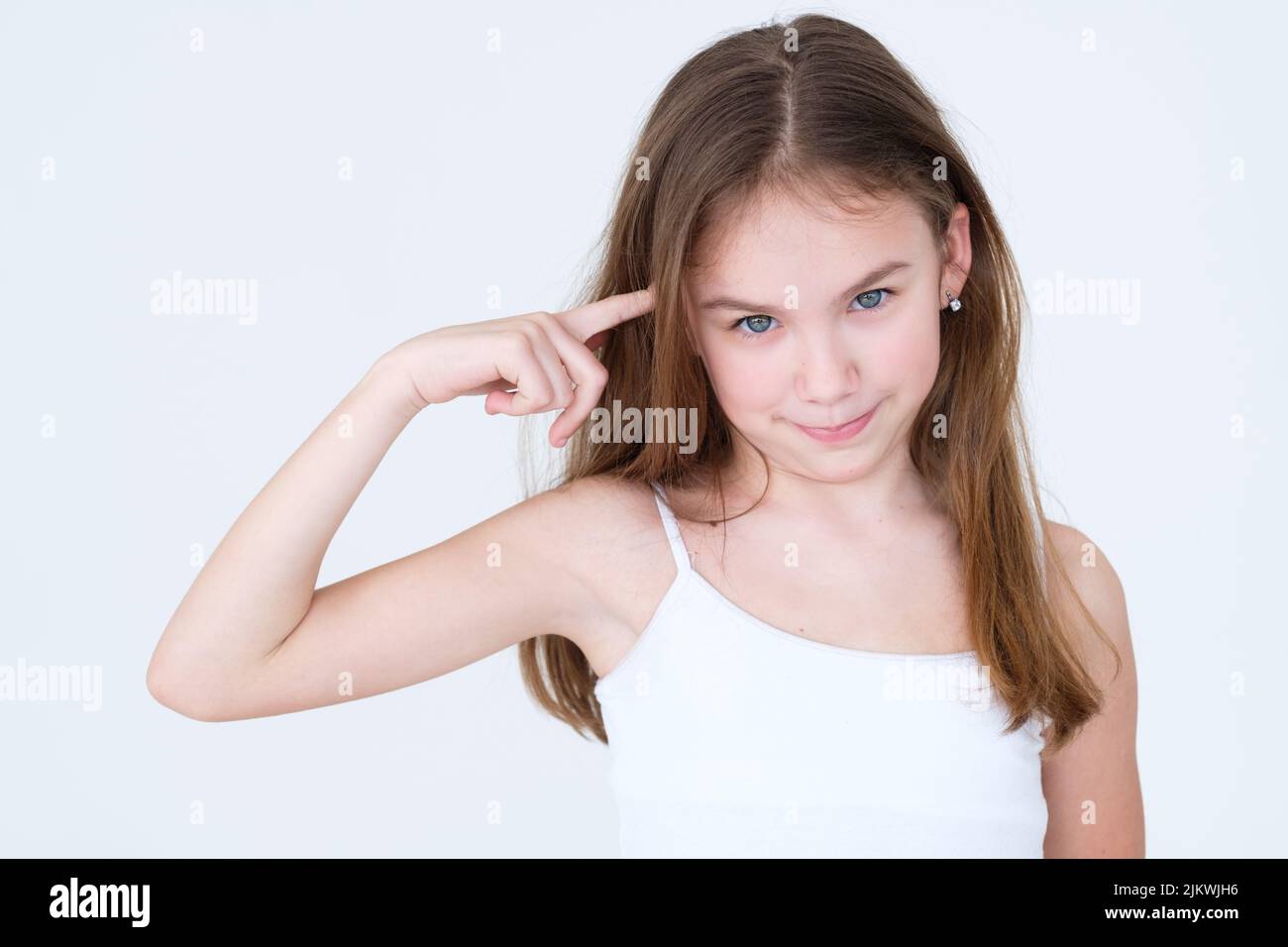 emotion disapproving child twisting finger temple Stock Photo - Alamy