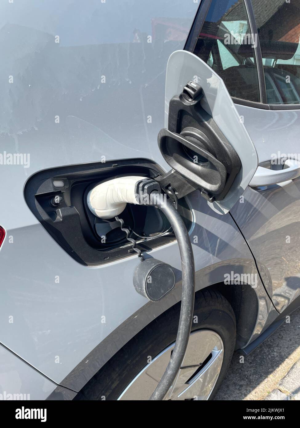 Electric car charging plug outdoors Stock Photo - Alamy