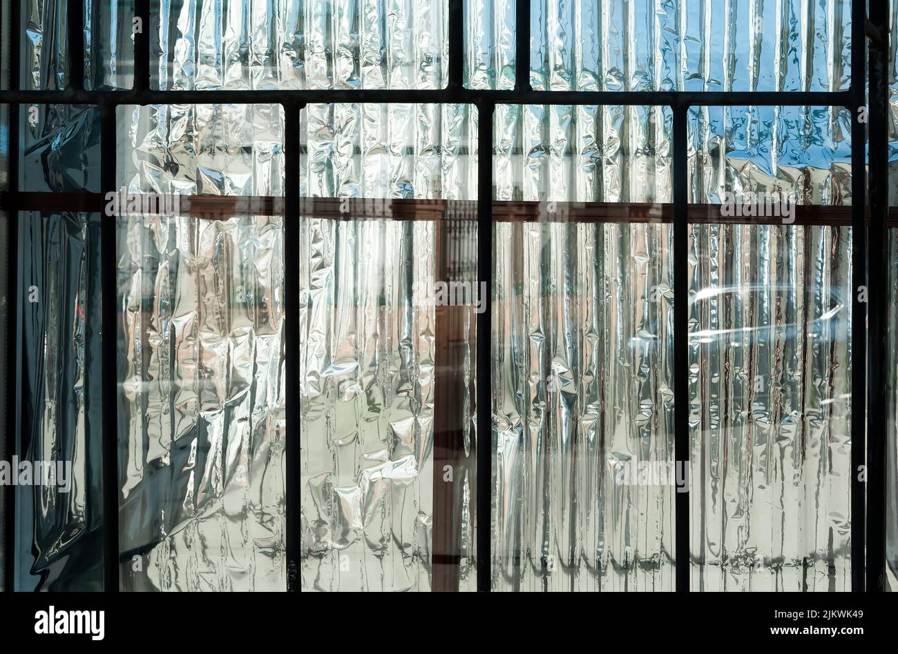 Window covered with foil film Stock Photo - Alamy