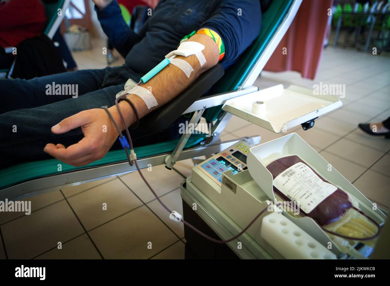 Blood donor in a blood collection facility Stock Photo - Alamy