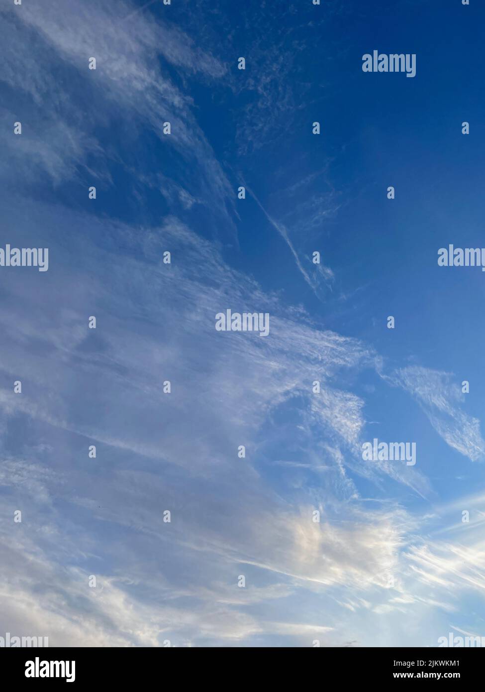 A perfect background of a blue cloudy sky Stock Photo - Alamy