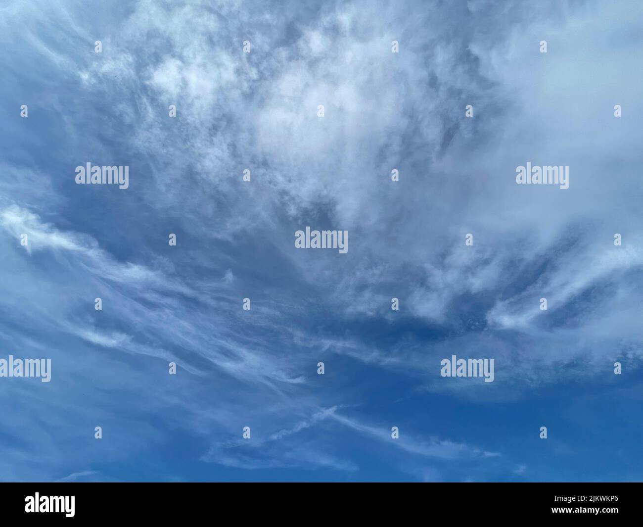 A perfect background of a blue cloudy sky Stock Photo - Alamy