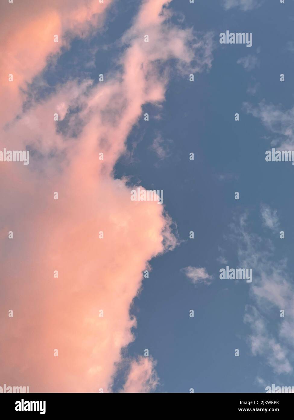 A perfect background of a blue cloudy sky Stock Photo - Alamy