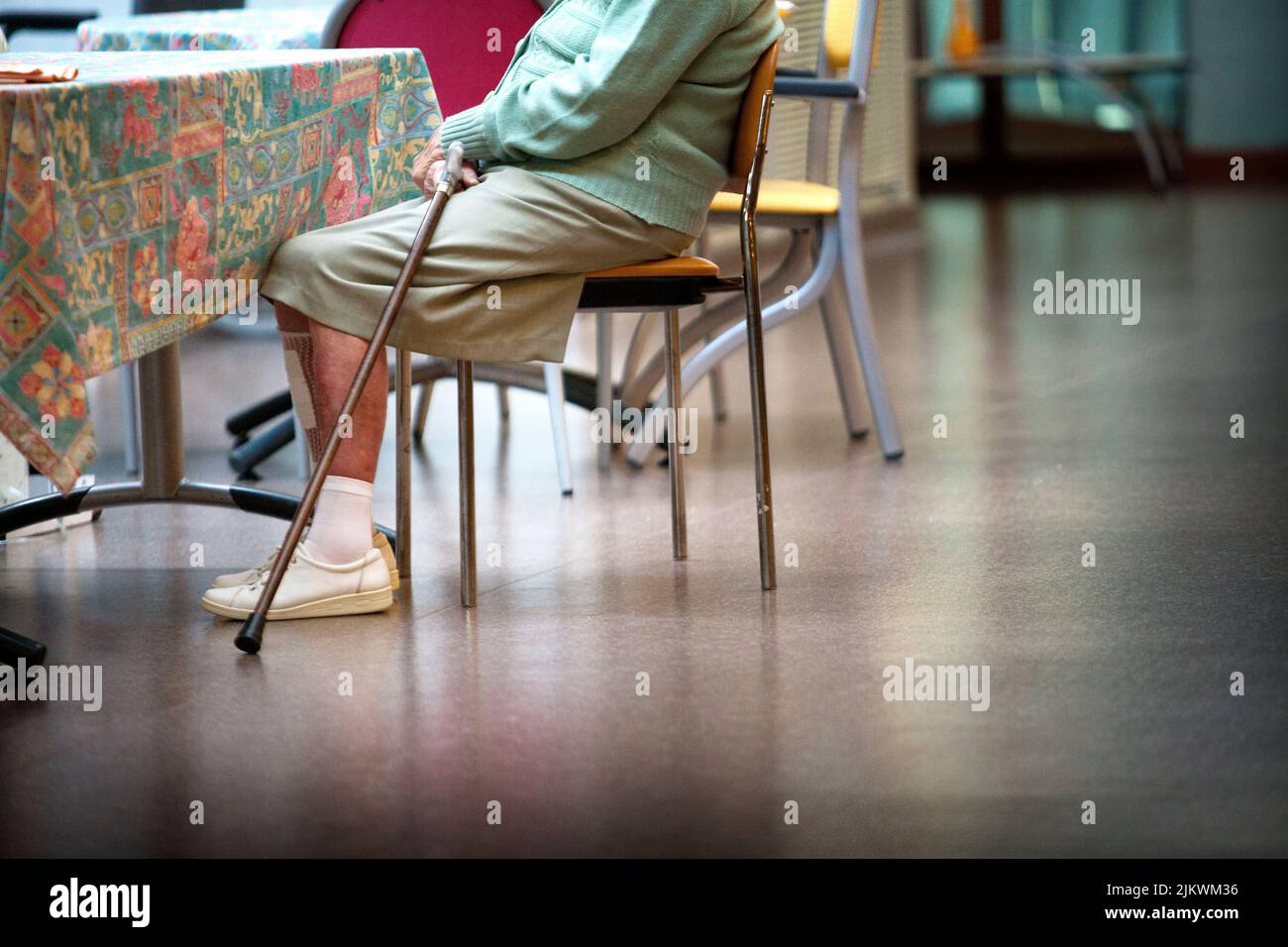 Elderly woman with her cane in a retirement home Stock Photo - Alamy