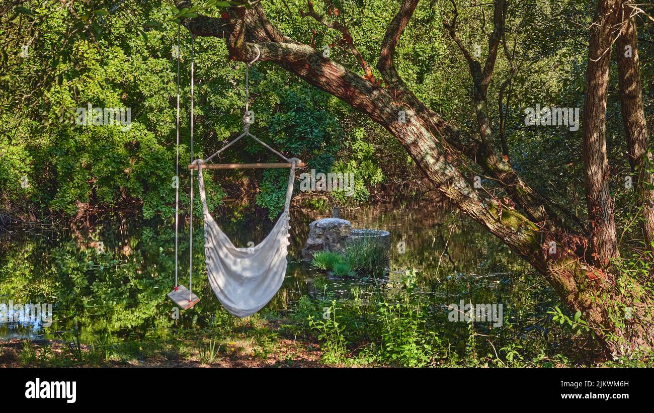 Tree with swing park hi-res stock photography and images - Alamy