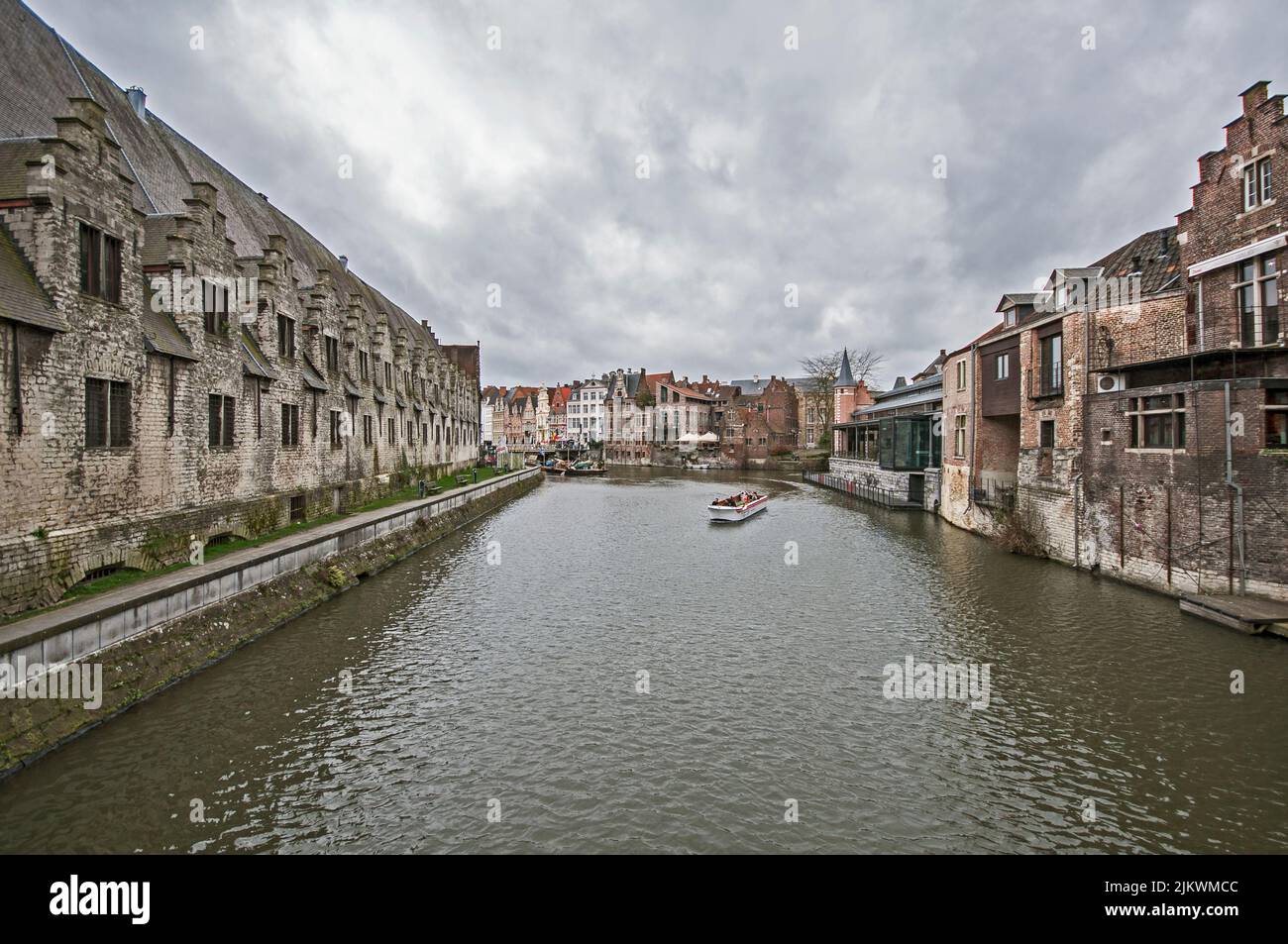 An aerial view of canal with floating boat surrounded by buildings in ...